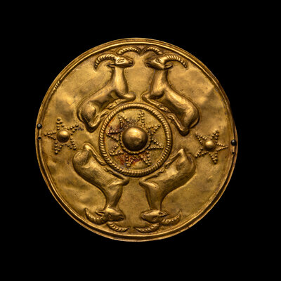 A Near East Gold Disk with Four Recumbent Rams Lot 90