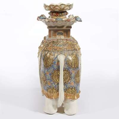 A large Japanese Satsuma-type enameled and gilt pottery figure of a ...
